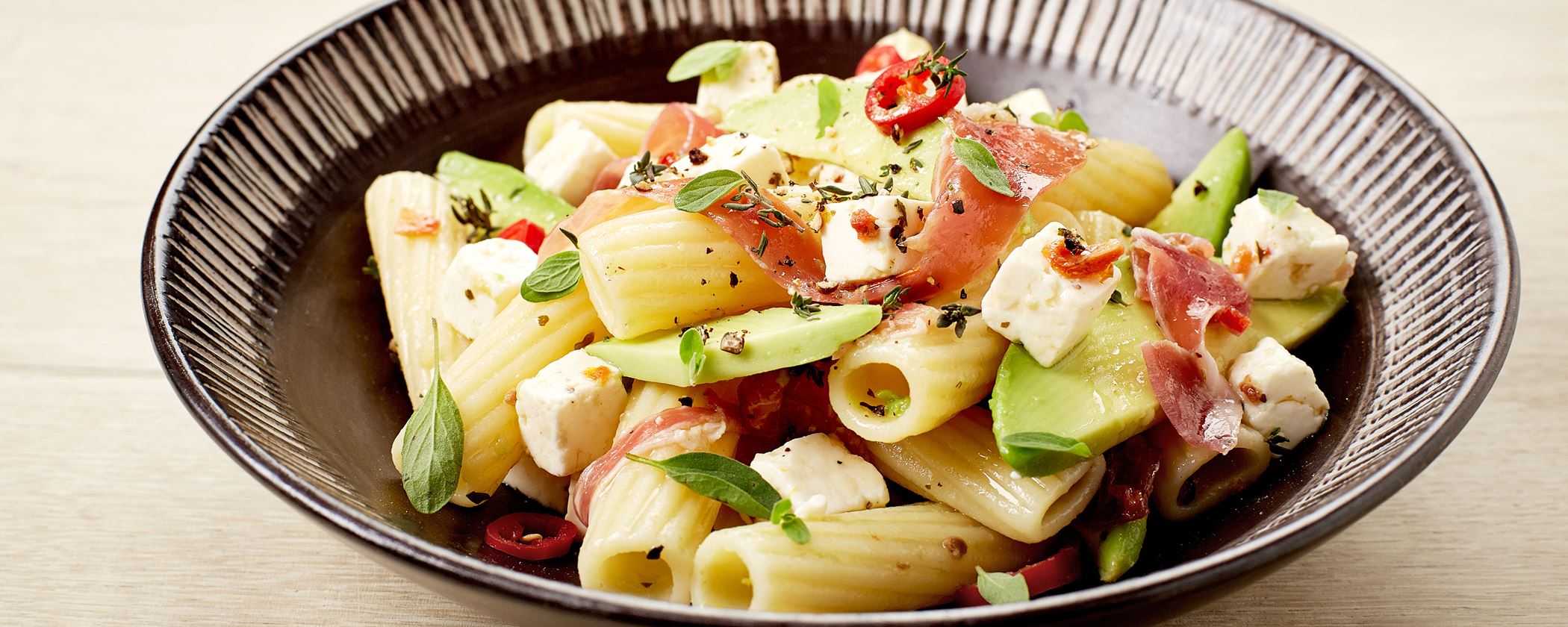 Pasta with sundried tomatoes, avocado, prosciutto and Castello® Greek ...