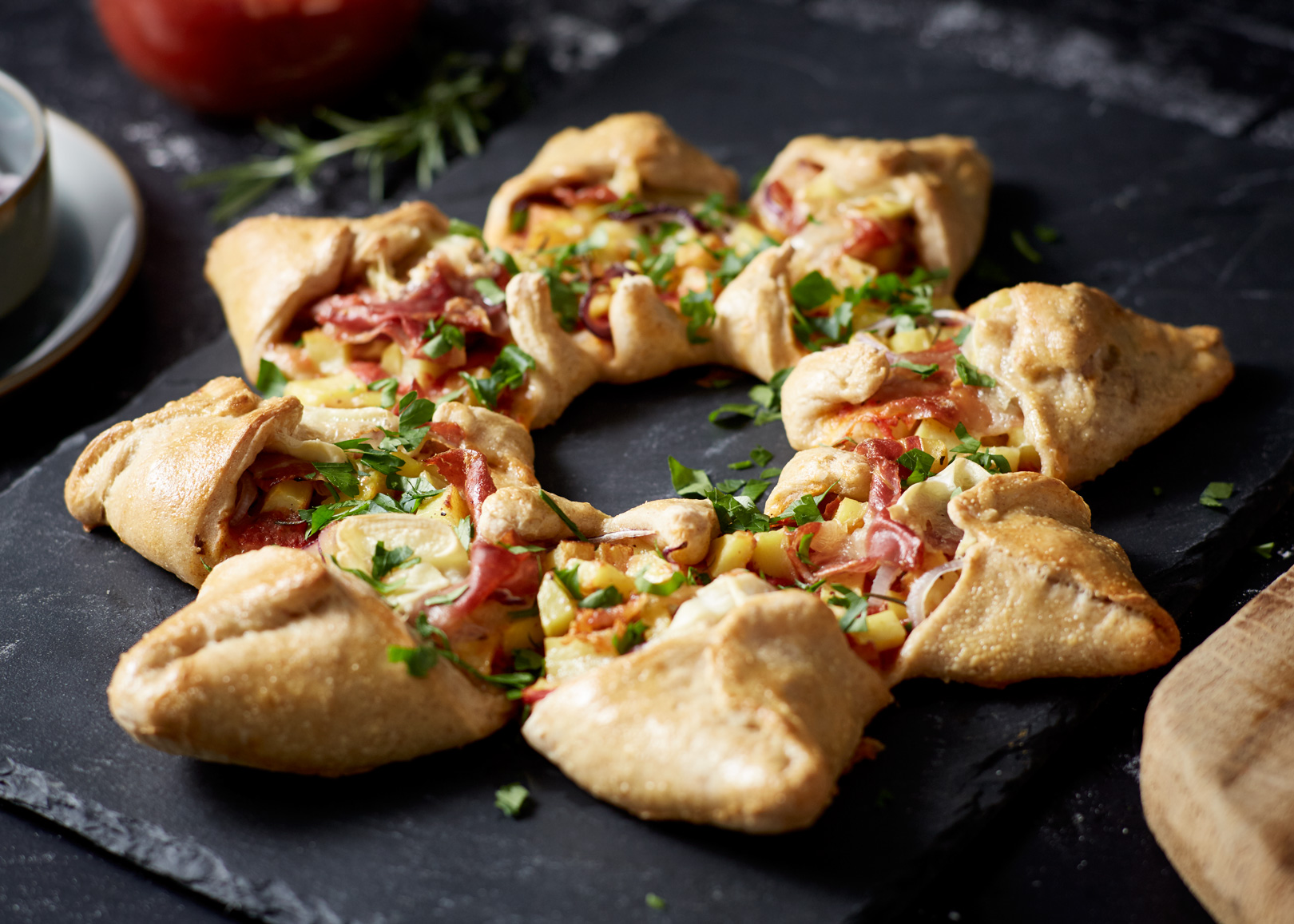 Star shaped pizza with Creamy White, potatoes, red onion, prosciutto ...